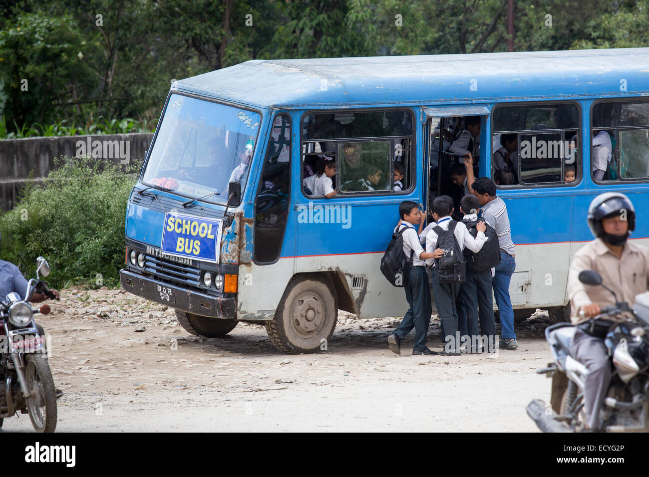 Boys boarding a school bus in Kathmandu, Nepal Stock Photo - Alamy