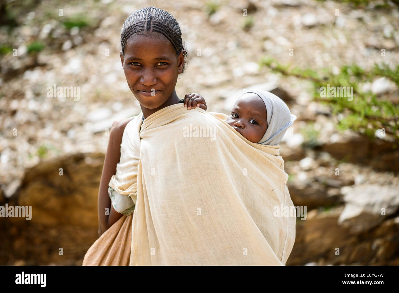 Woman carrying baby back hi-res stock photography and images - Alamy