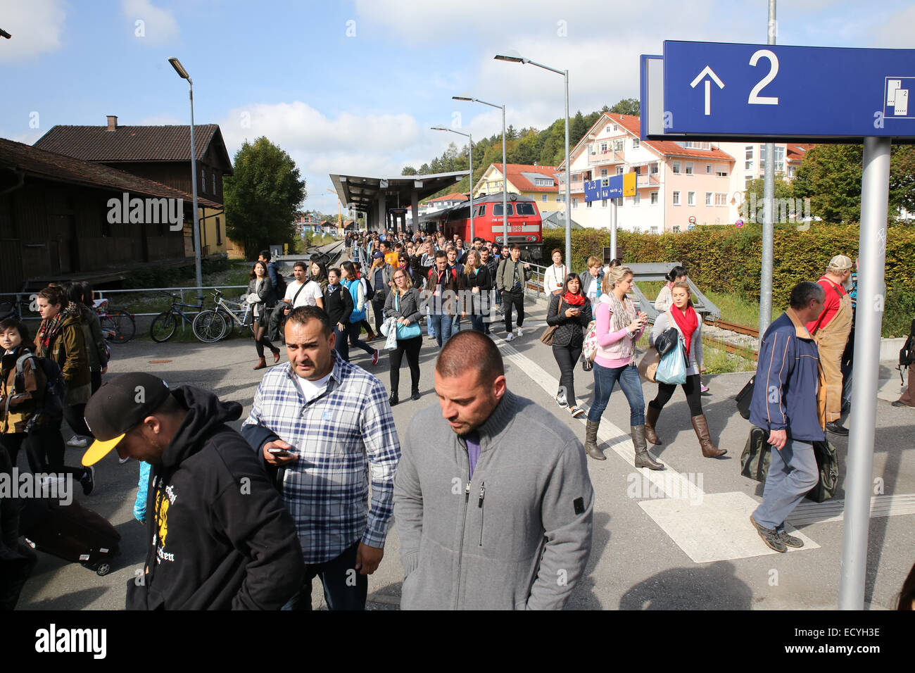 passenger get off busy train station outdoor sunny europe crowd people ...