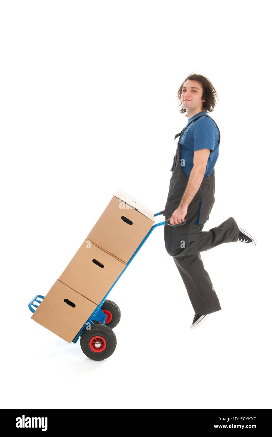 man as happy jumping industrial mover with hand truck and boxes Stock ...