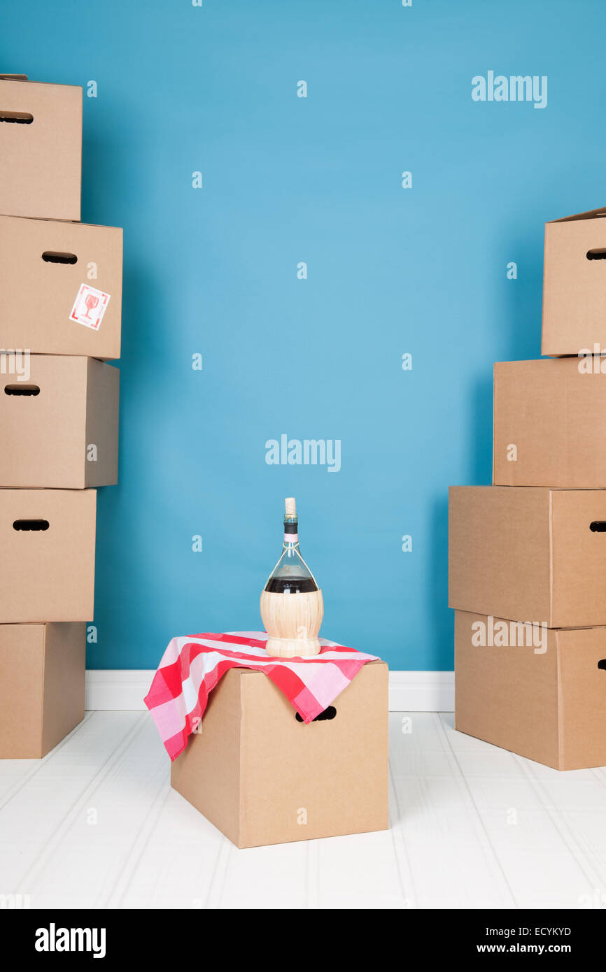 Moving into a new house with many unpacked boxes Stock Photo - Alamy