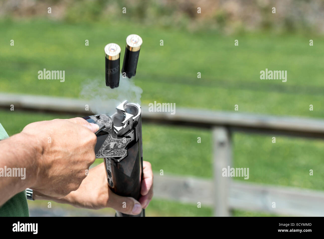 shotgun shell flying out of a shotgun after shoot Stock Photo - Alamy
