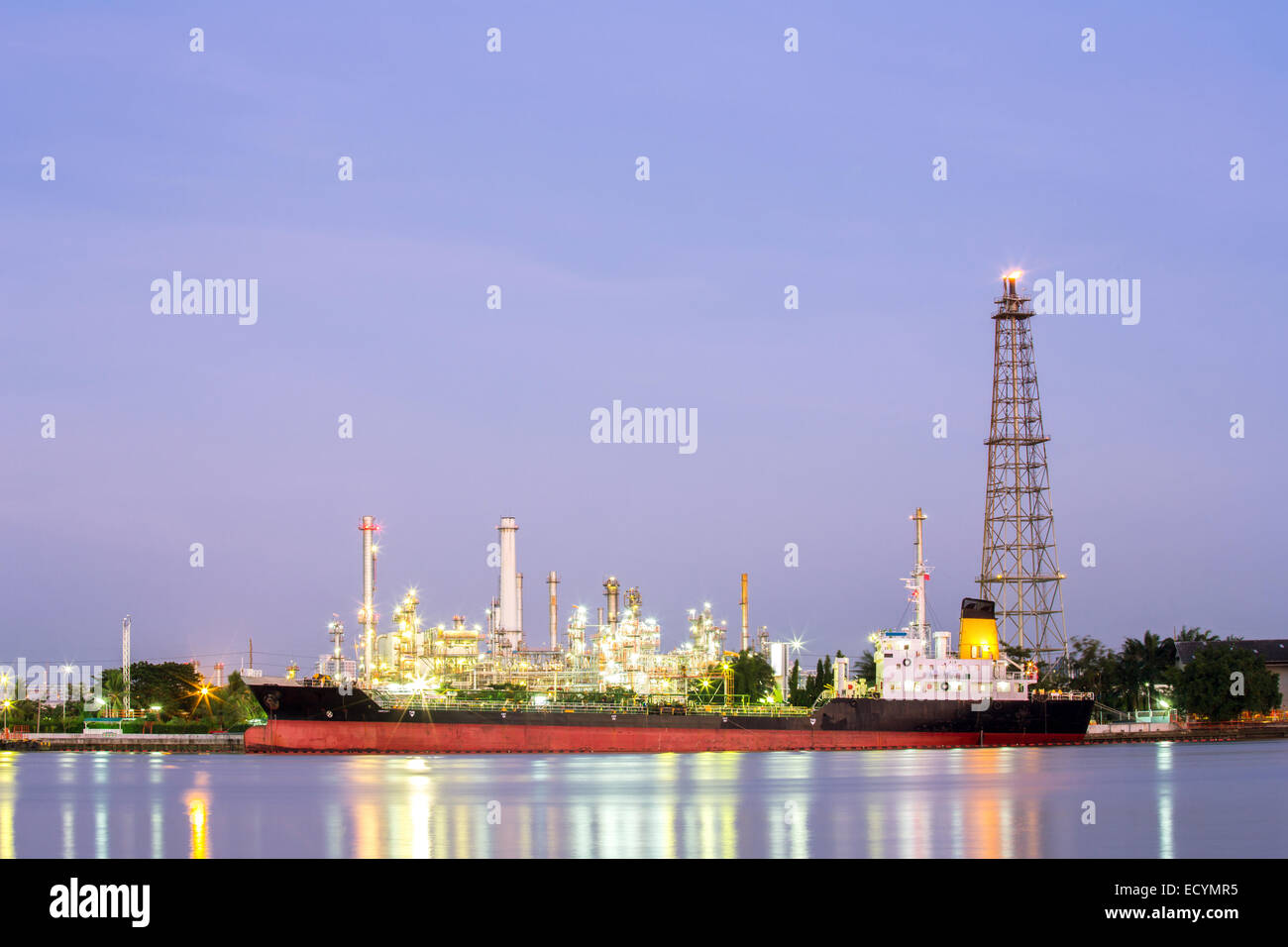 landscape of Oil refinery plant along river with tanker at dusk Stock ...