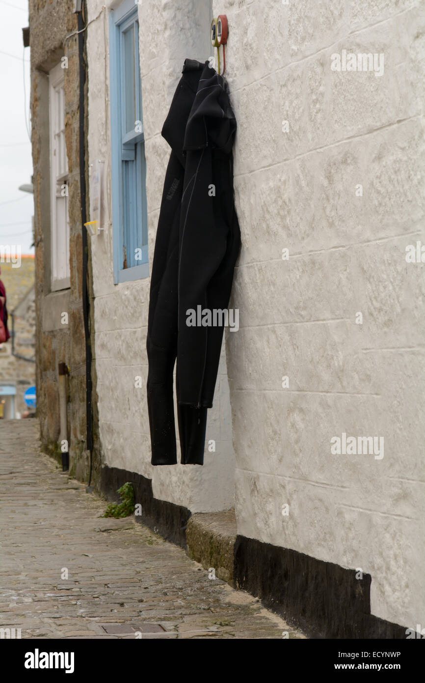 Wetsuit drying hi-res stock photography and images - Alamy