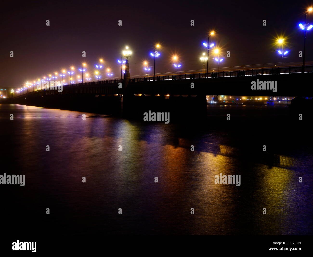 Stone Bridge lights in fog ,Riga Stock Photo - Alamy