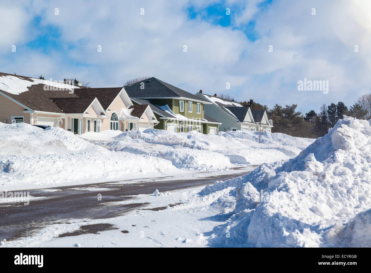 Piles of snow from plowed roads in the suburbs Stock Photo - Alamy