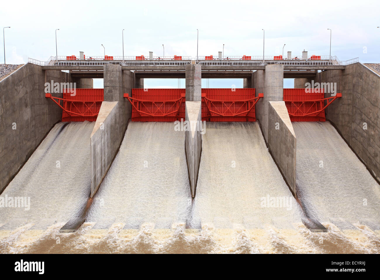 Water pouring through the water gates at dam Stock Photo - Alamy
