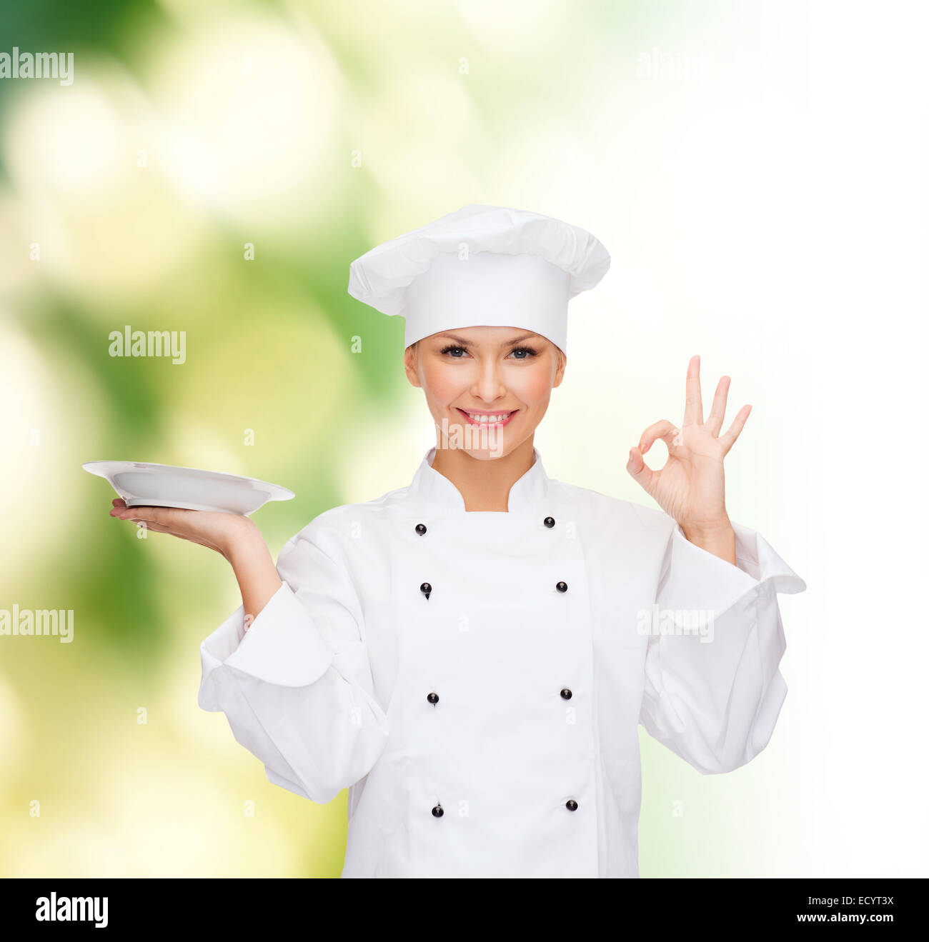 female chef with plate showing ok sign Stock Photo - Alamy