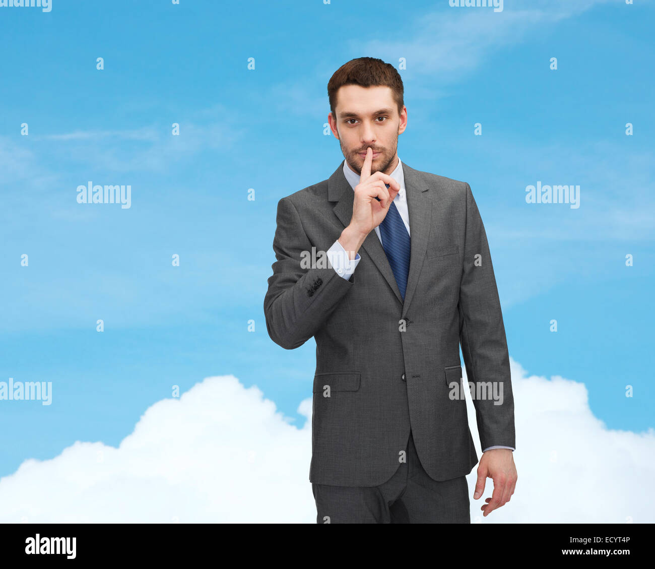 young businessman making hush sign Stock Photo - Alamy