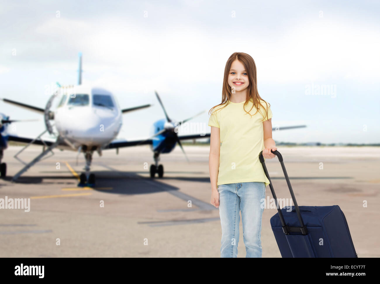 smiling girl with travel bag in airport Stock Photo - Alamy