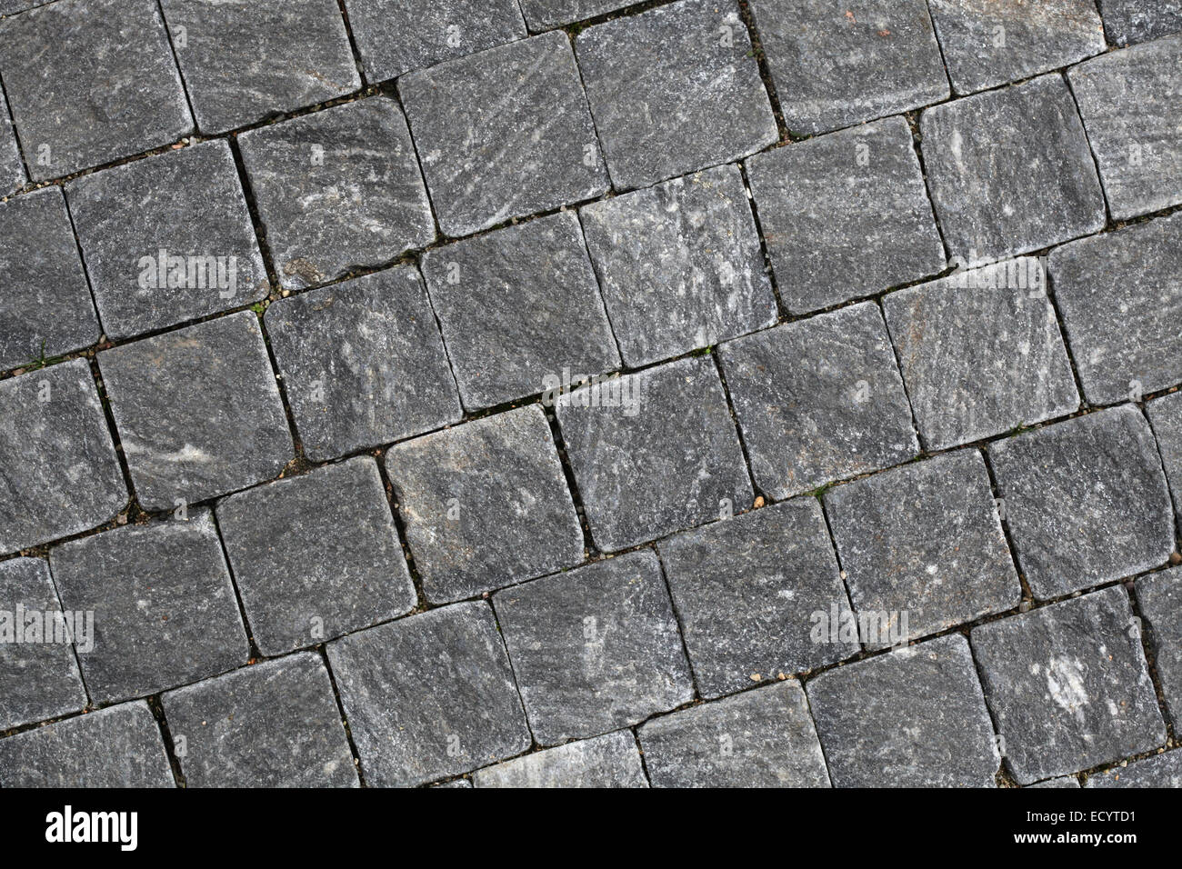 Cobbled pavement made of granite cubes. Background texture Stock Photo ...
