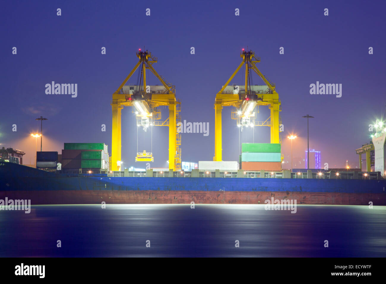 Container stacks and crane in shipyard at dusk for cargo Goods and ...
