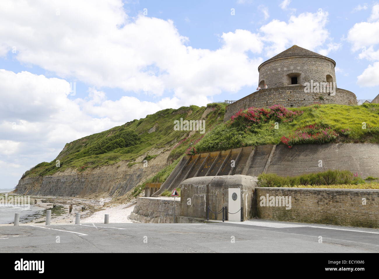 The harbour harbor and cliff top fort at Port En Bessin, Normandy ...