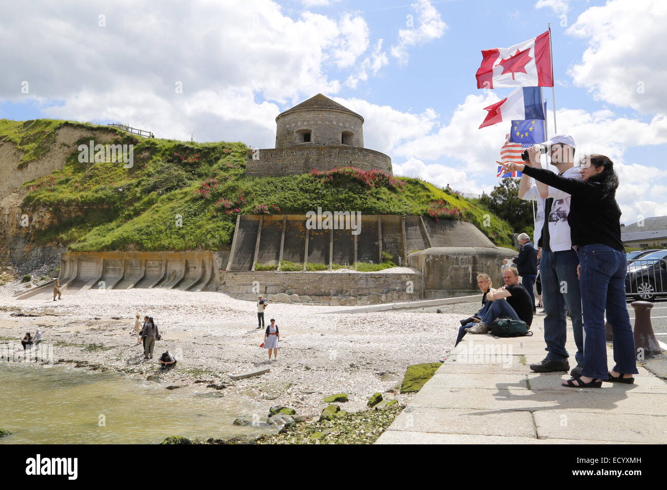The harbour harbor and cliff top fort at Port En Bessin, Normandy ...