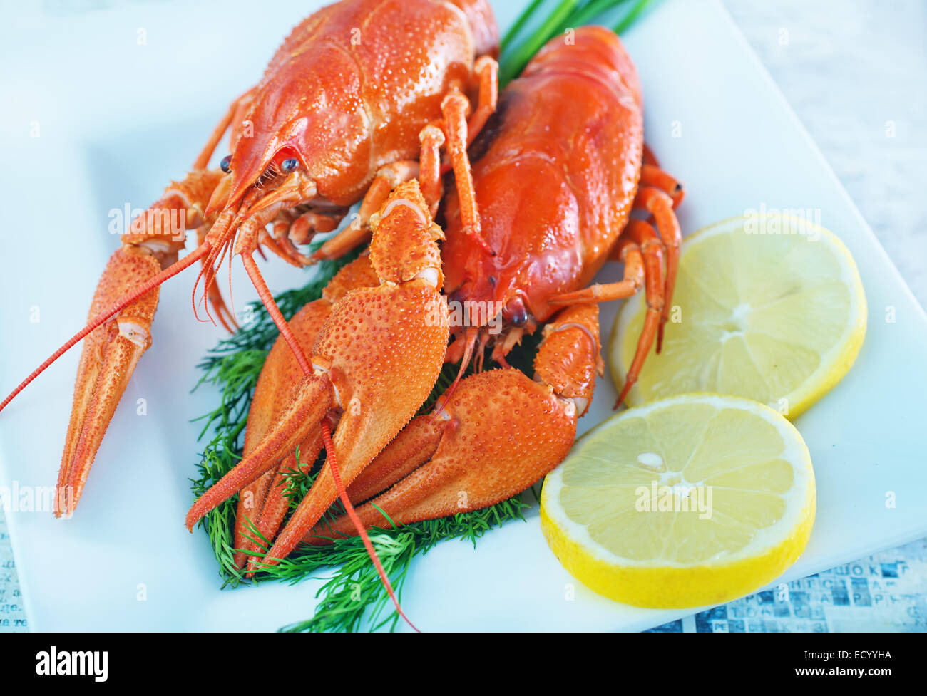 boiled crawfish with fresh lemon on the plate Stock Photo - Alamy