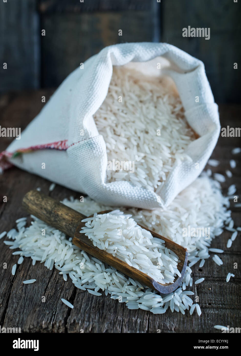 raw rice in bag and on a table Stock Photo - Alamy