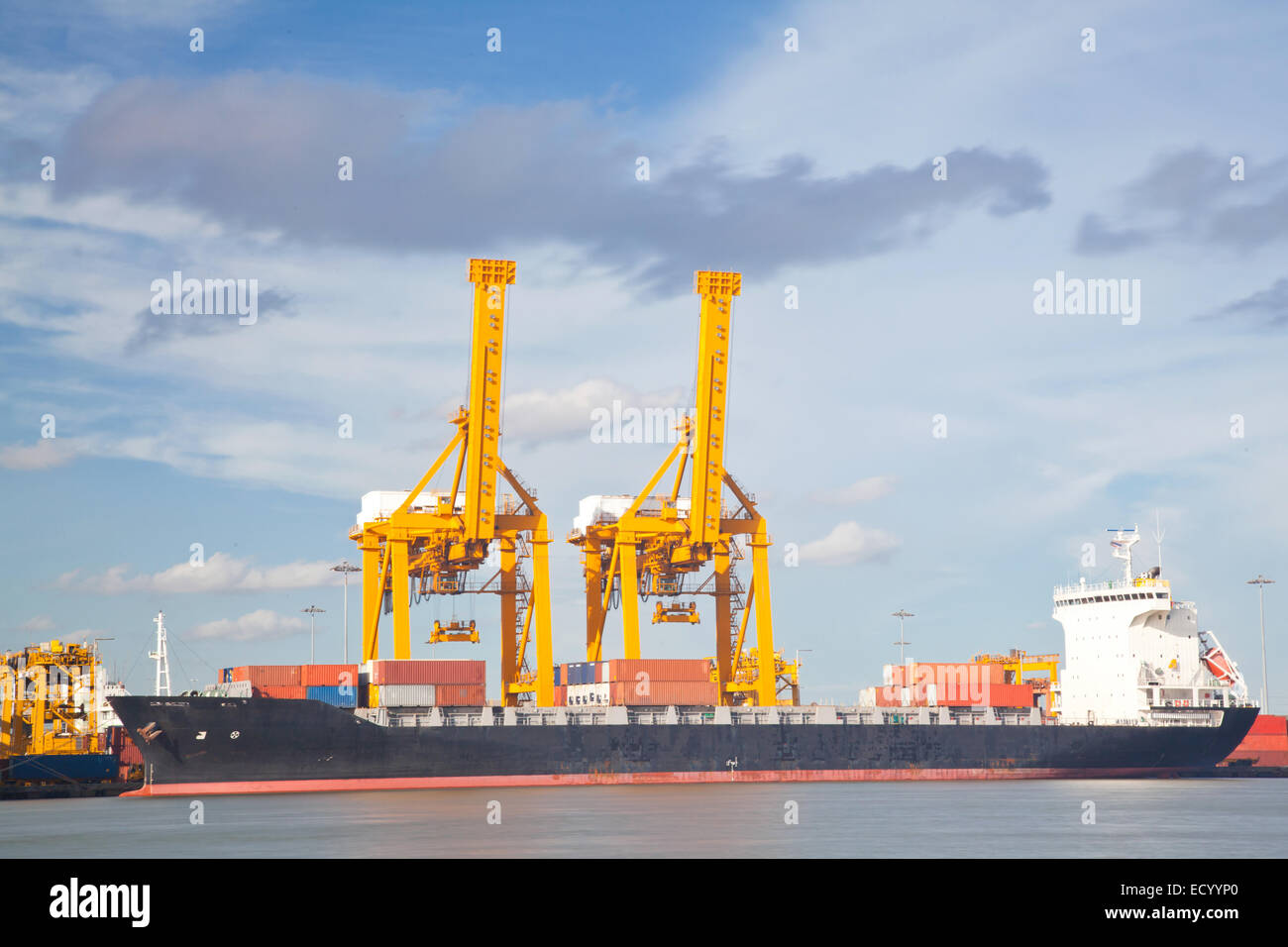 Container Cargo freight Industrial ship with working crane bridge ...