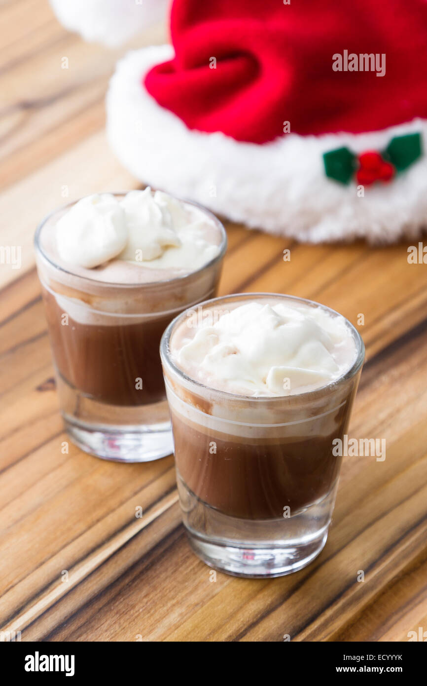 holiday shooters chocolate and peppermint on a wooden background with a ...