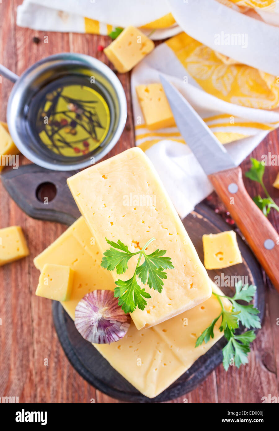 cheese on board and on a table Stock Photo - Alamy