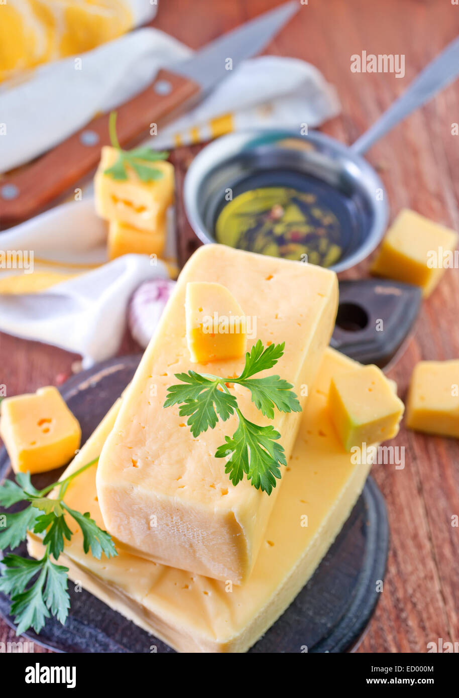 cheese on board and on a table Stock Photo - Alamy