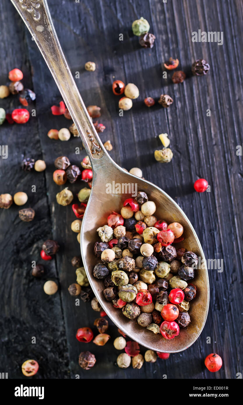 pepper mix in metal spoon and on a table Stock Photo - Alamy