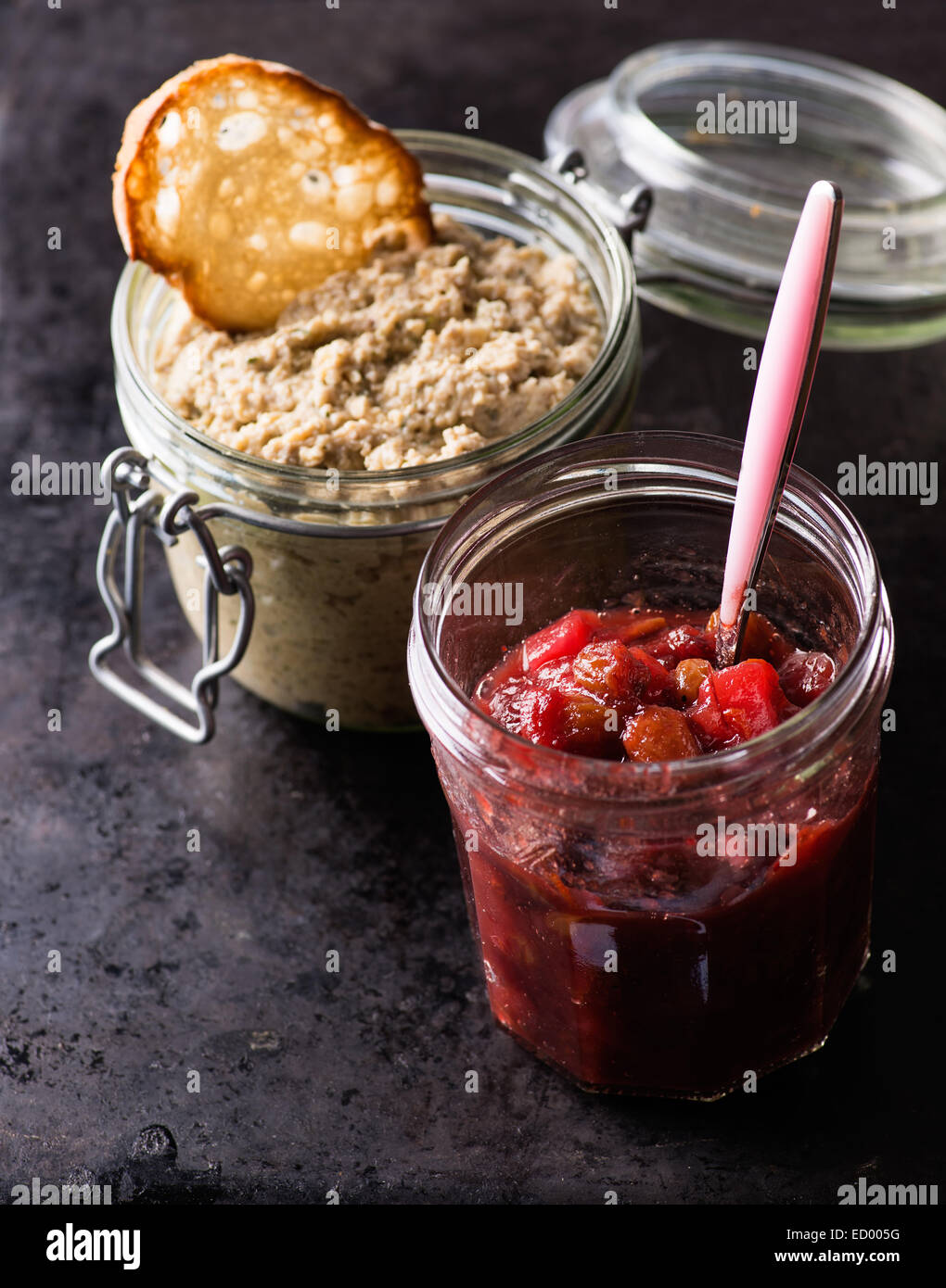 Cranberry relish and mushroom pate over dark background Stock Photo - Alamy