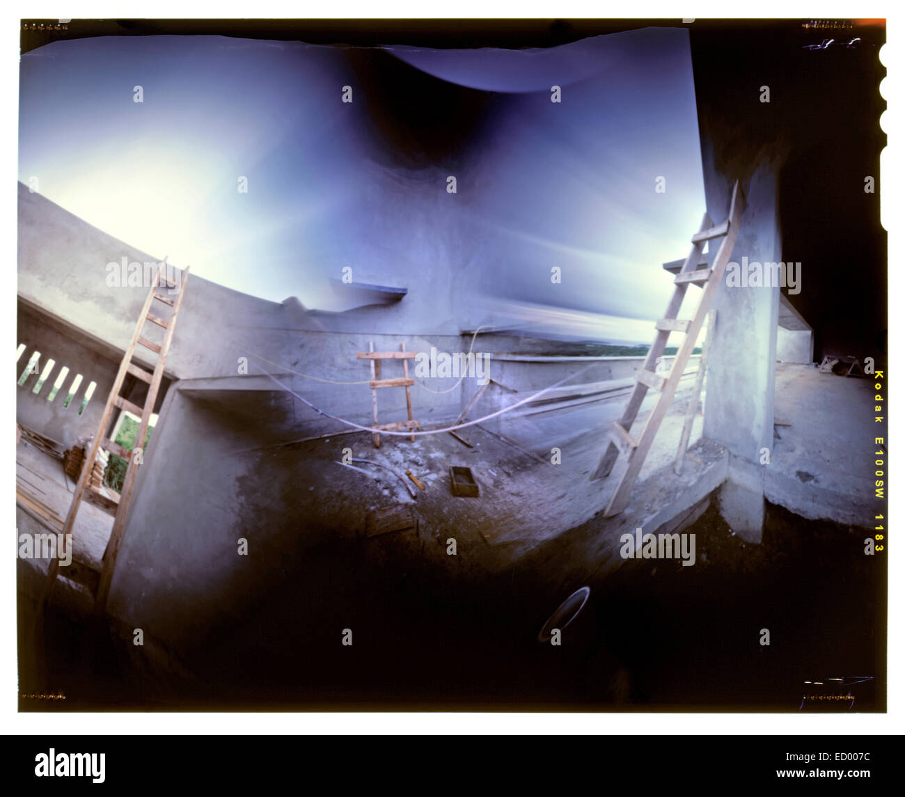 a pinhole image of three handmade ladders at the construction site of a ...