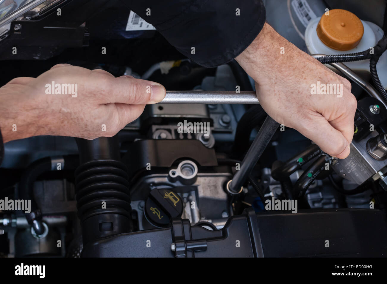 Hands repairing a car engine with a wrench Stock Photo - Alamy