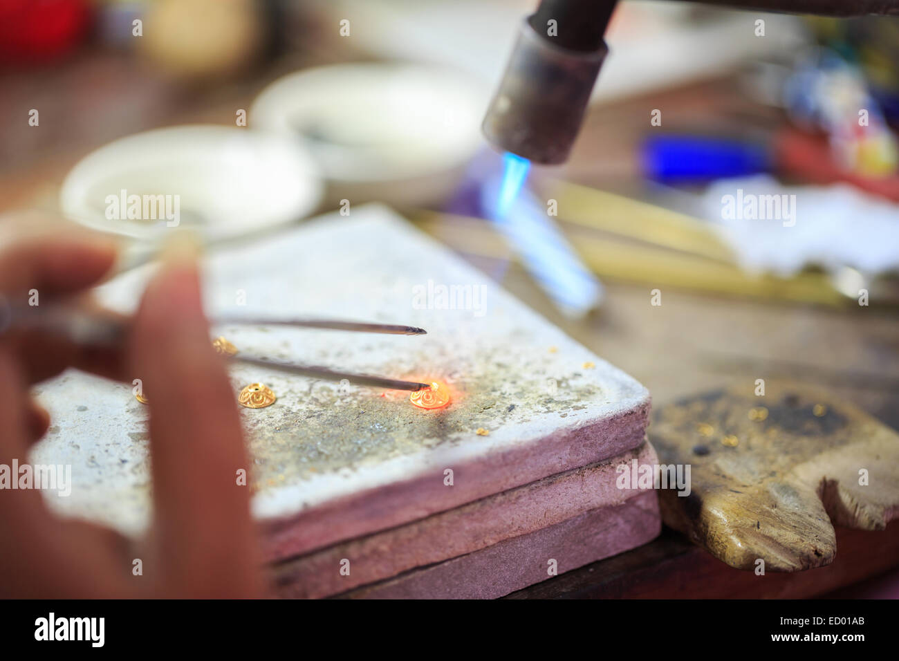 Goldsmith working with a thai traditional gold Stock Photo - Alamy