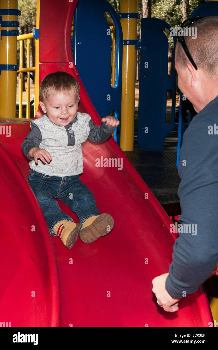 Going down the slide hi-res stock photography and images - Alamy