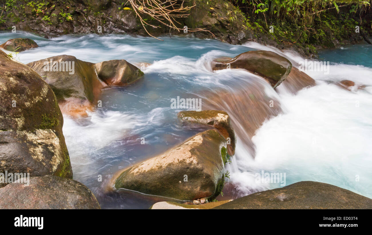 The cerulean blue waters of the Rio Celeste in Volcan Tenorio National ...