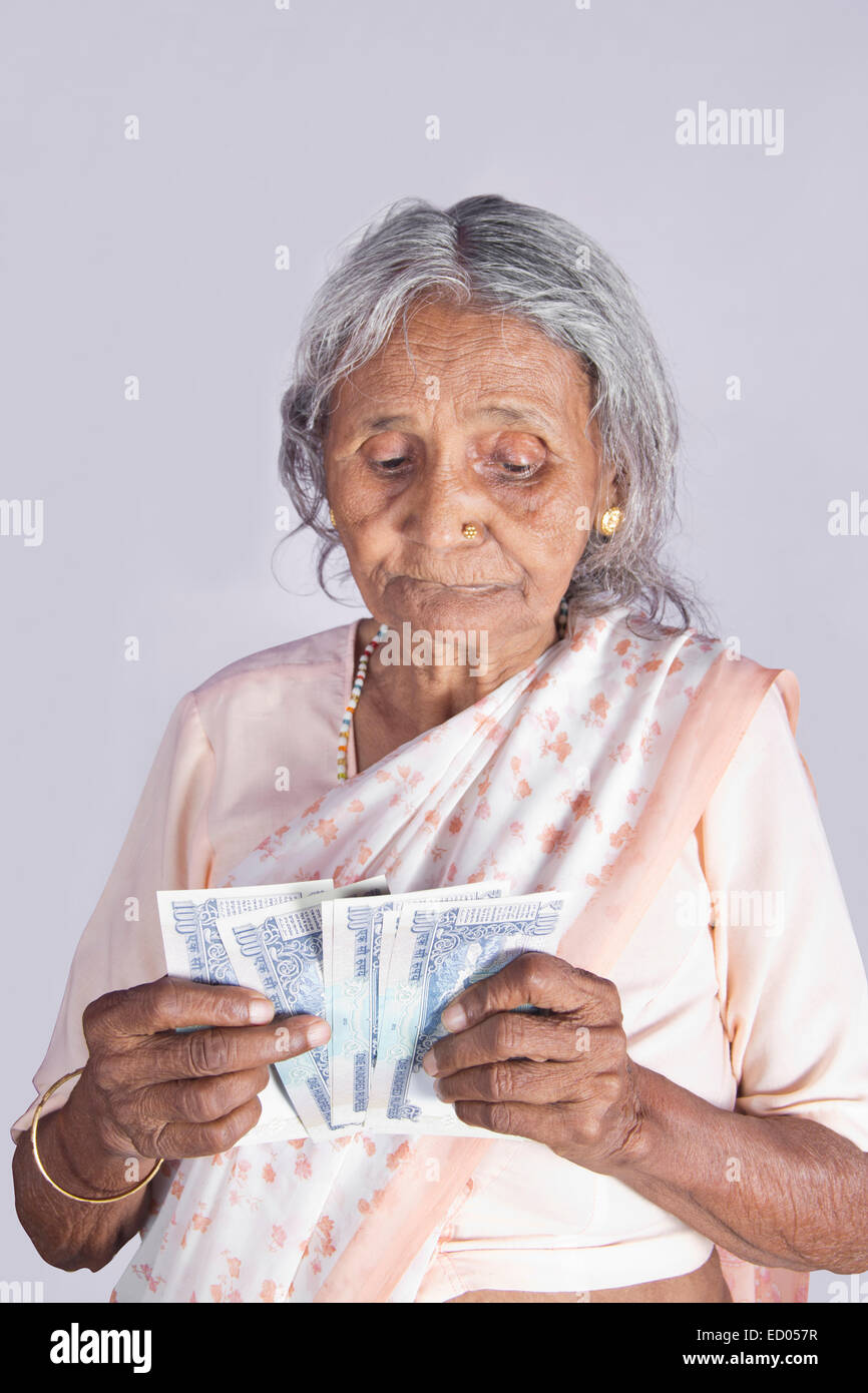 1 indian Old Senior Woman Saving money Stock Photo - Alamy