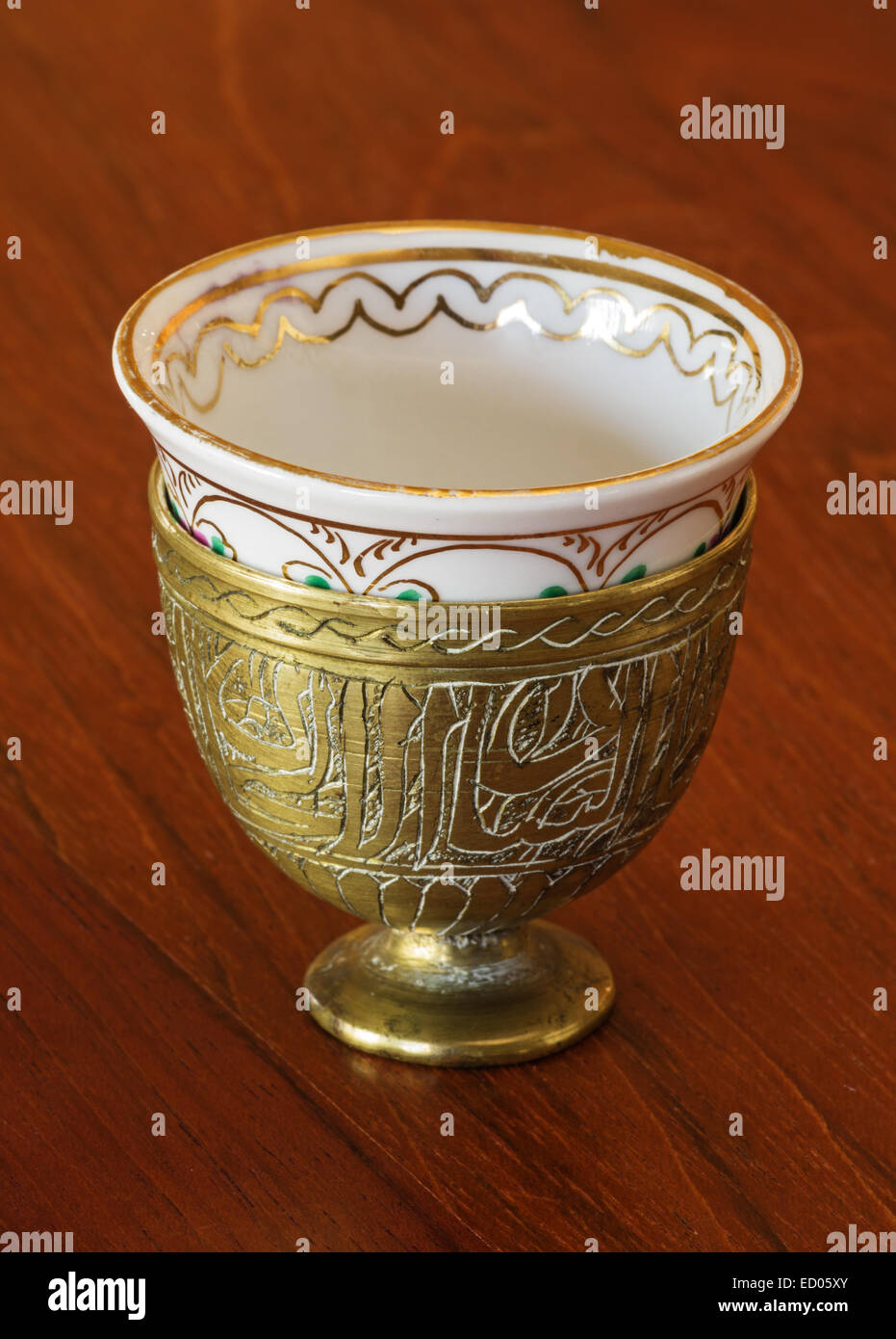ornate antique brass zarf with china cup on wood Stock Photo - Alamy