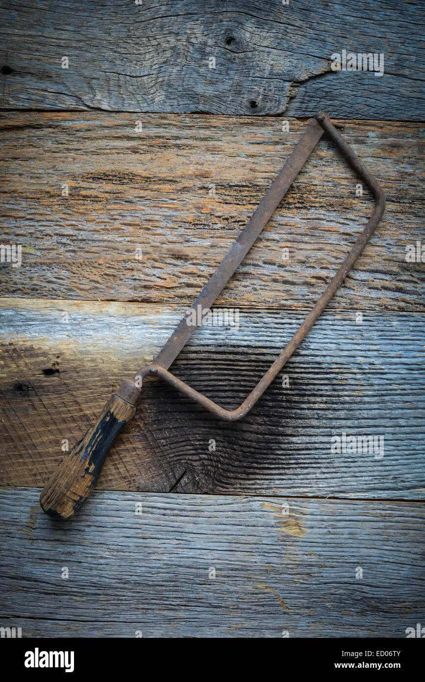 Hand Saw on Rustic Wood Background Stock Photo - Alamy
