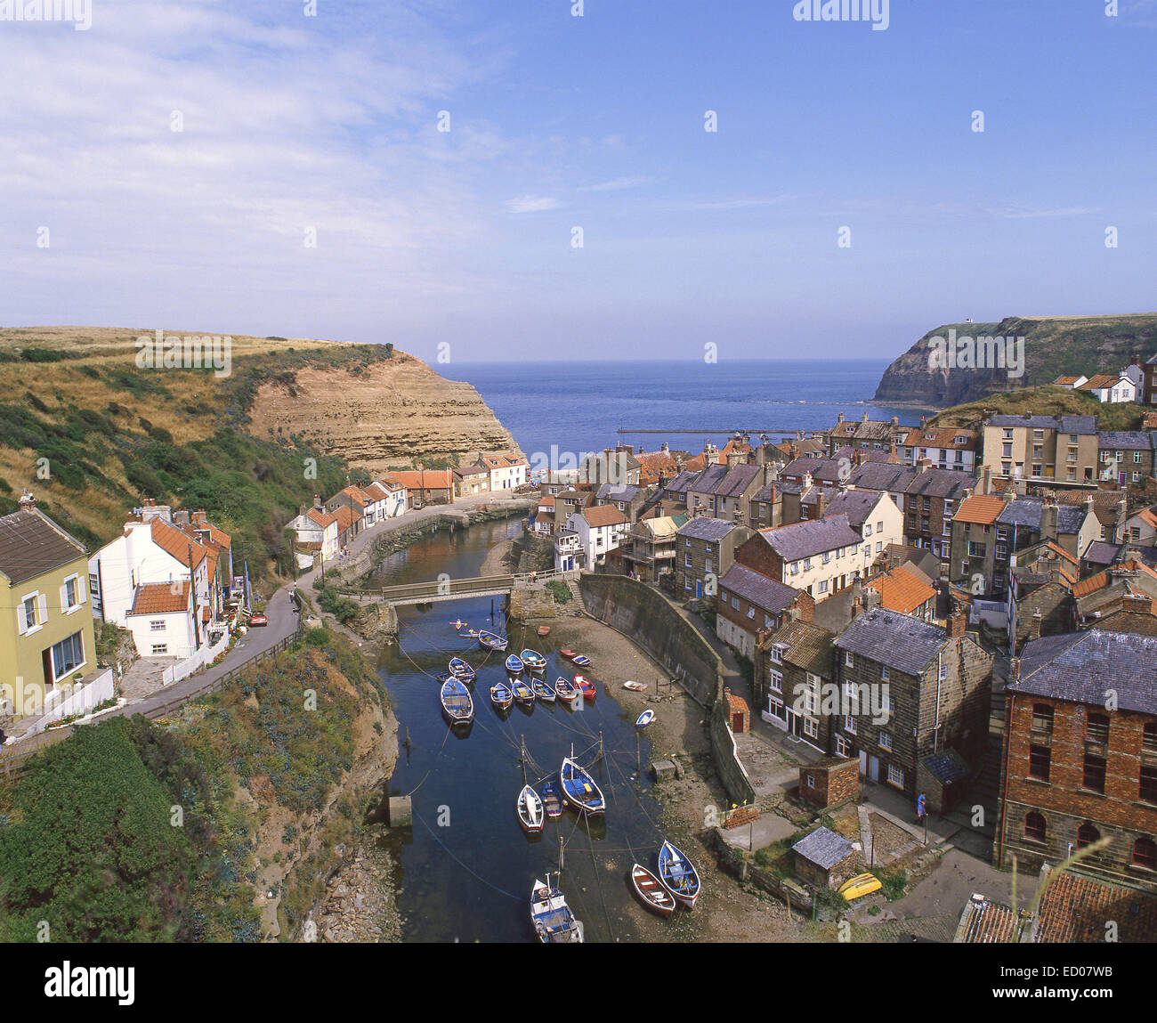 View of town and harbour, Staithes, North Yorkshire, England, United ...
