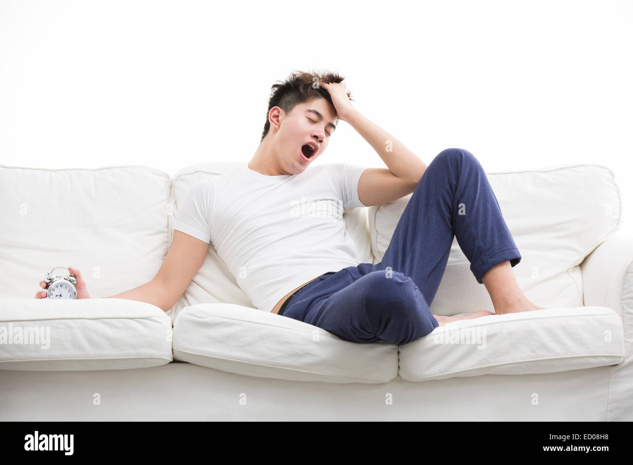 Young man just waking up Stock Photo - Alamy