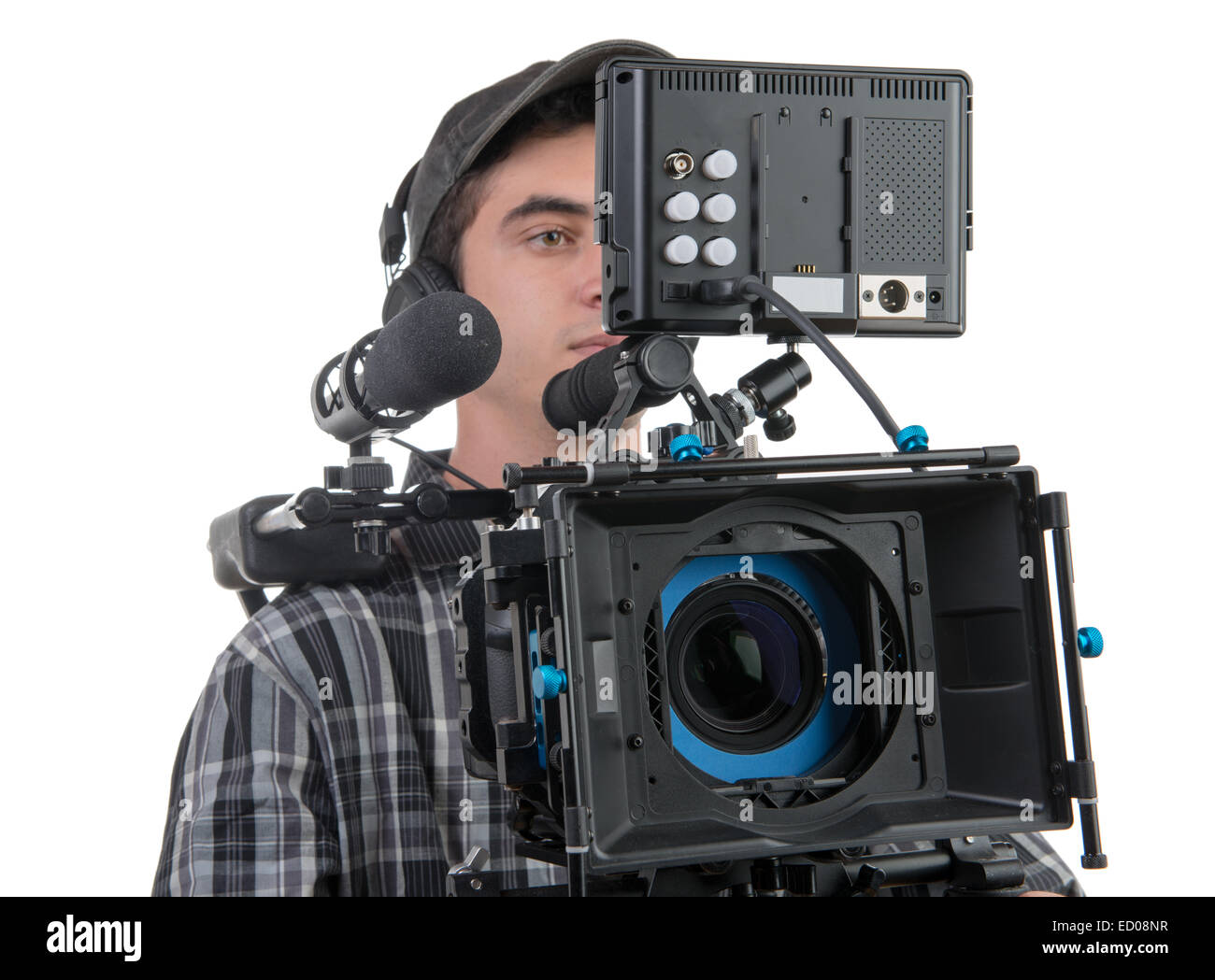 young cameraman and professional camera on the white background Stock ...