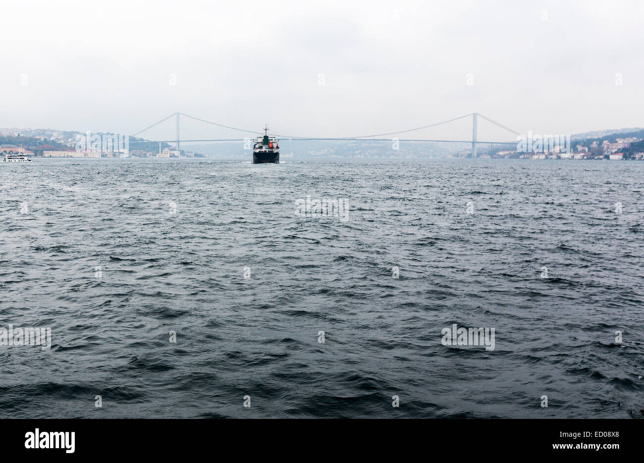 A ship is approaching a bridge at the Bosphorus, Istanbul Stock Photo ...