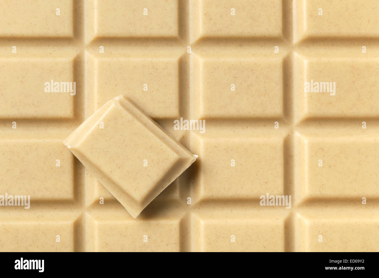 Block of white milky chocolate and single piece Stock Photo - Alamy