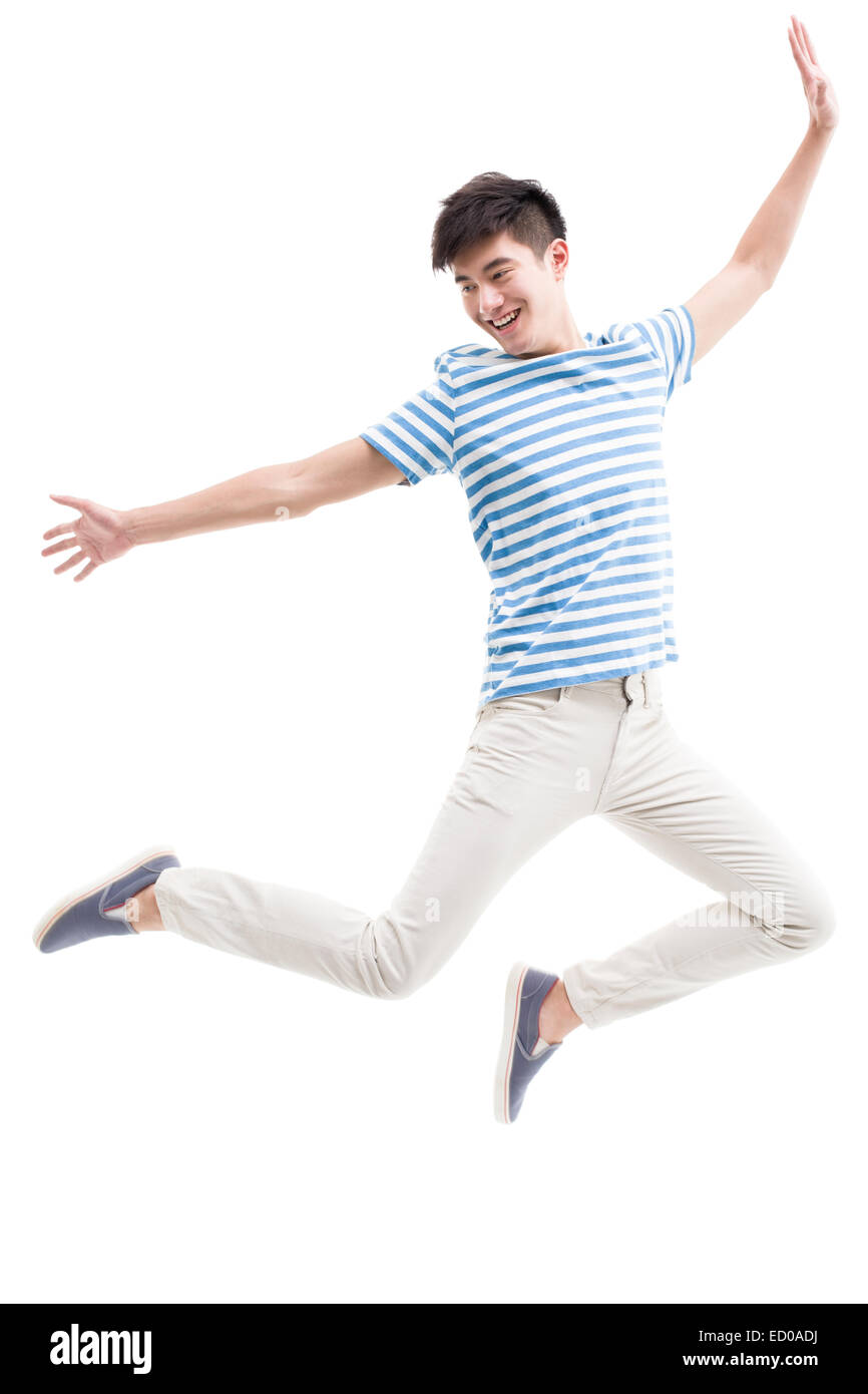 Happy young man jumping Stock Photo - Alamy