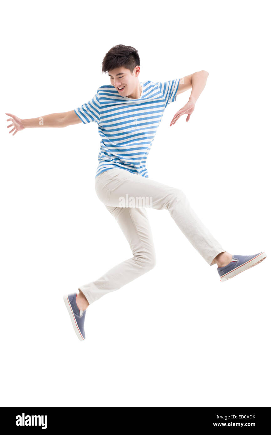 Happy young man jumping Stock Photo - Alamy