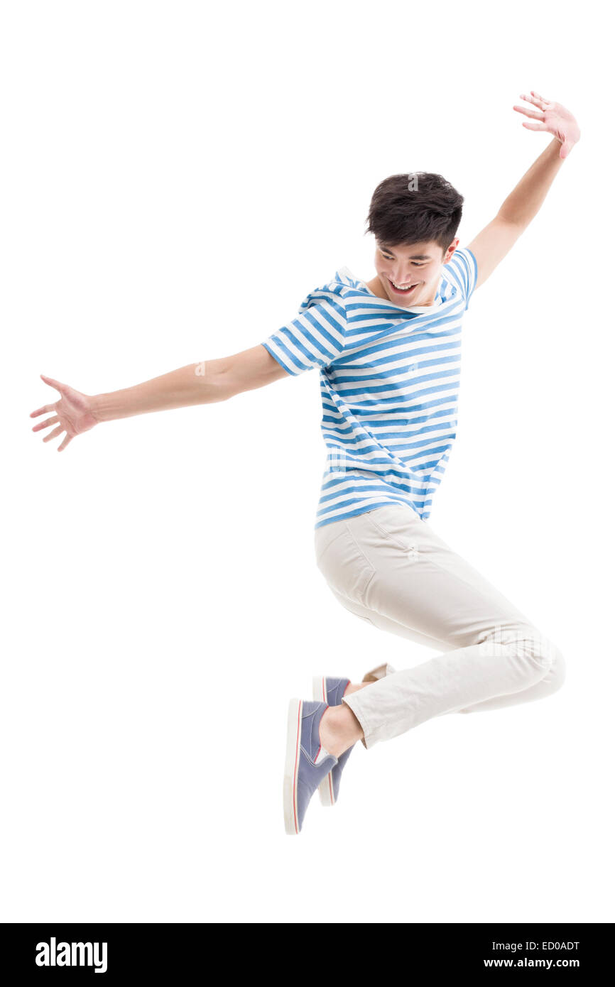 Happy young man jumping Stock Photo - Alamy