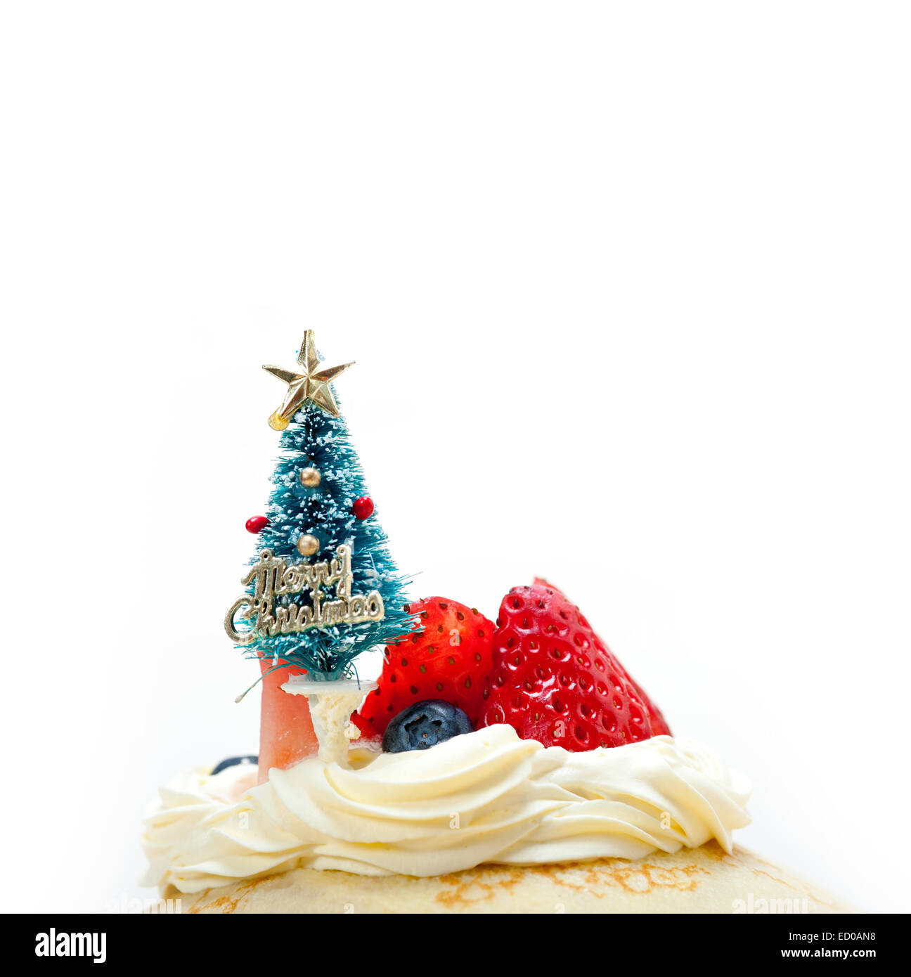 christmas tree on top of a pancake crepe mountain with whipped cream ...