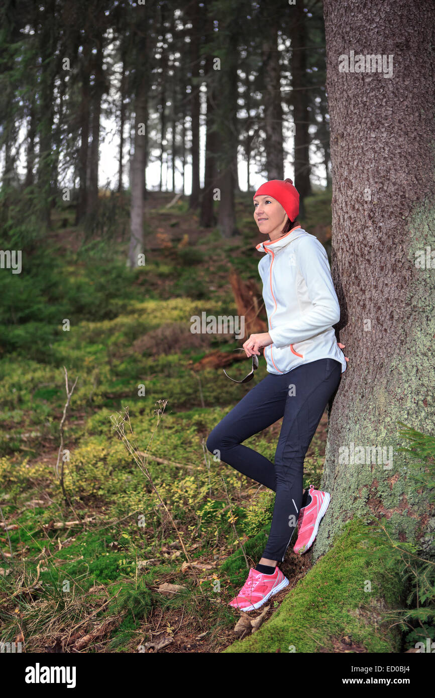 woman running through the forest by the lake Stock Photo - Alamy