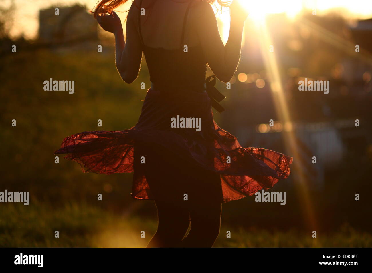 Silhouette of woman dancing at sunset hi-res stock photography and ...