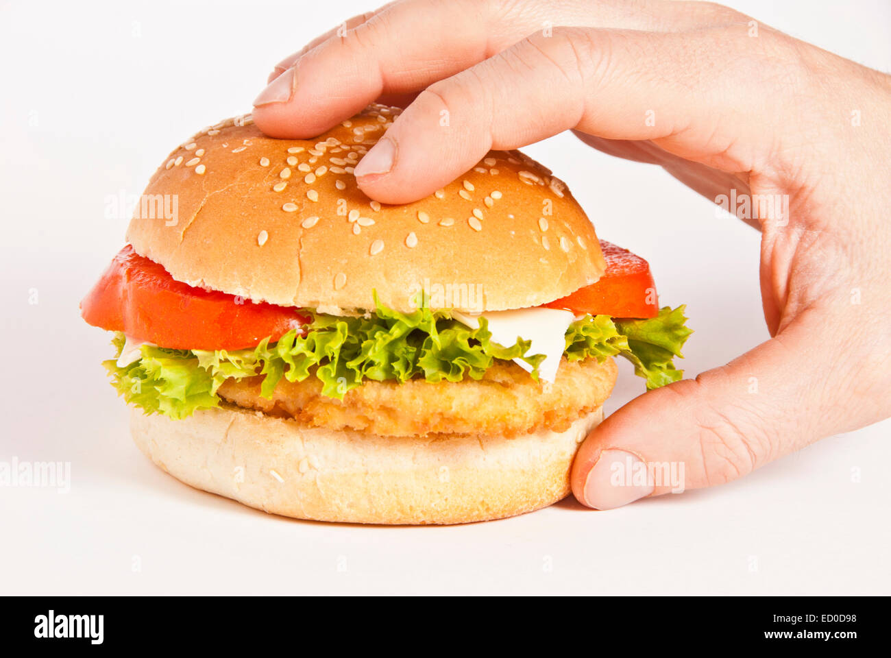 hand grabbing a cheeseburger Stock Photo - Alamy