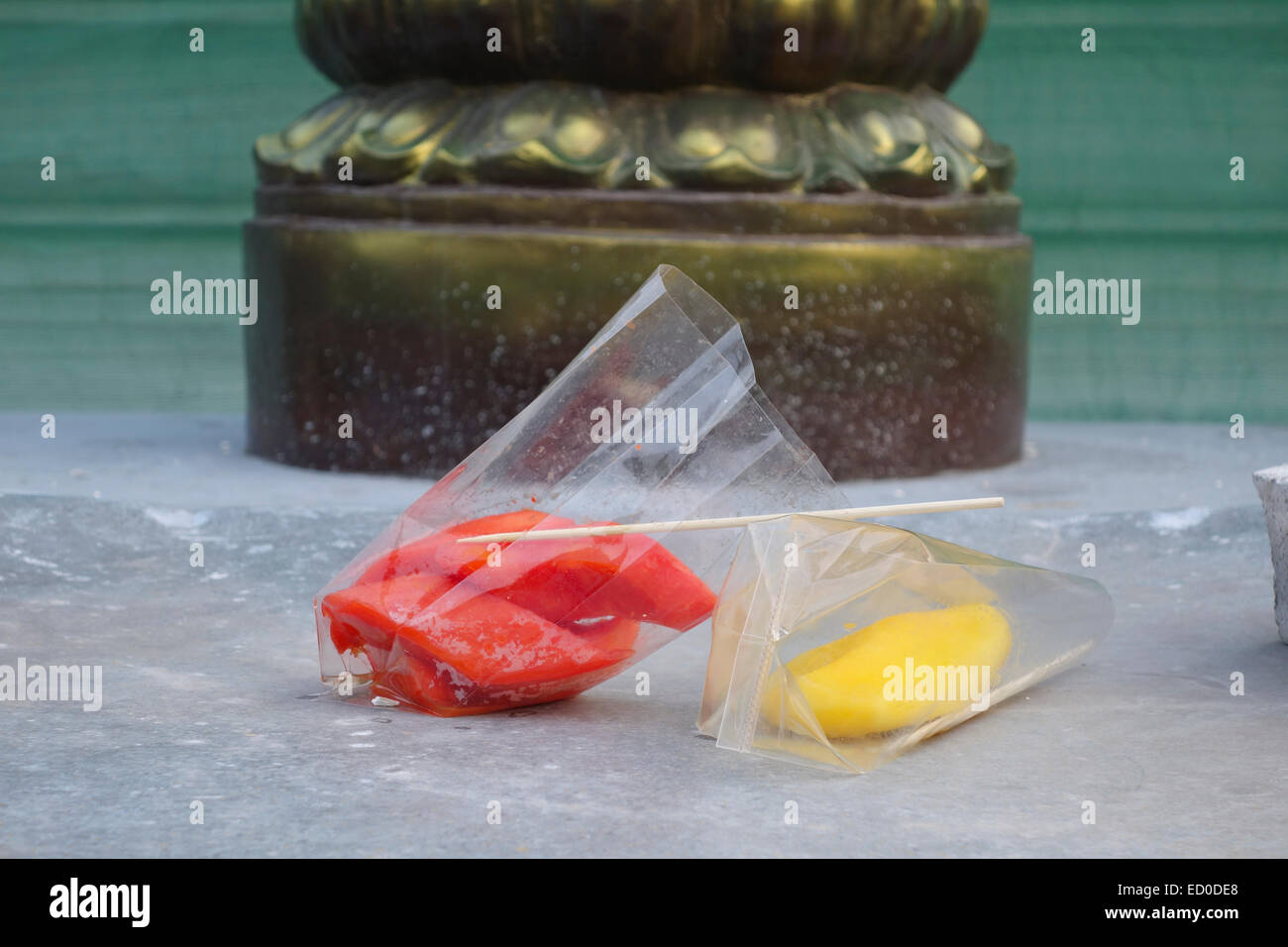 Fruit offerings in front of Buddhist statue ia a Wat Temple in Bangkok ...
