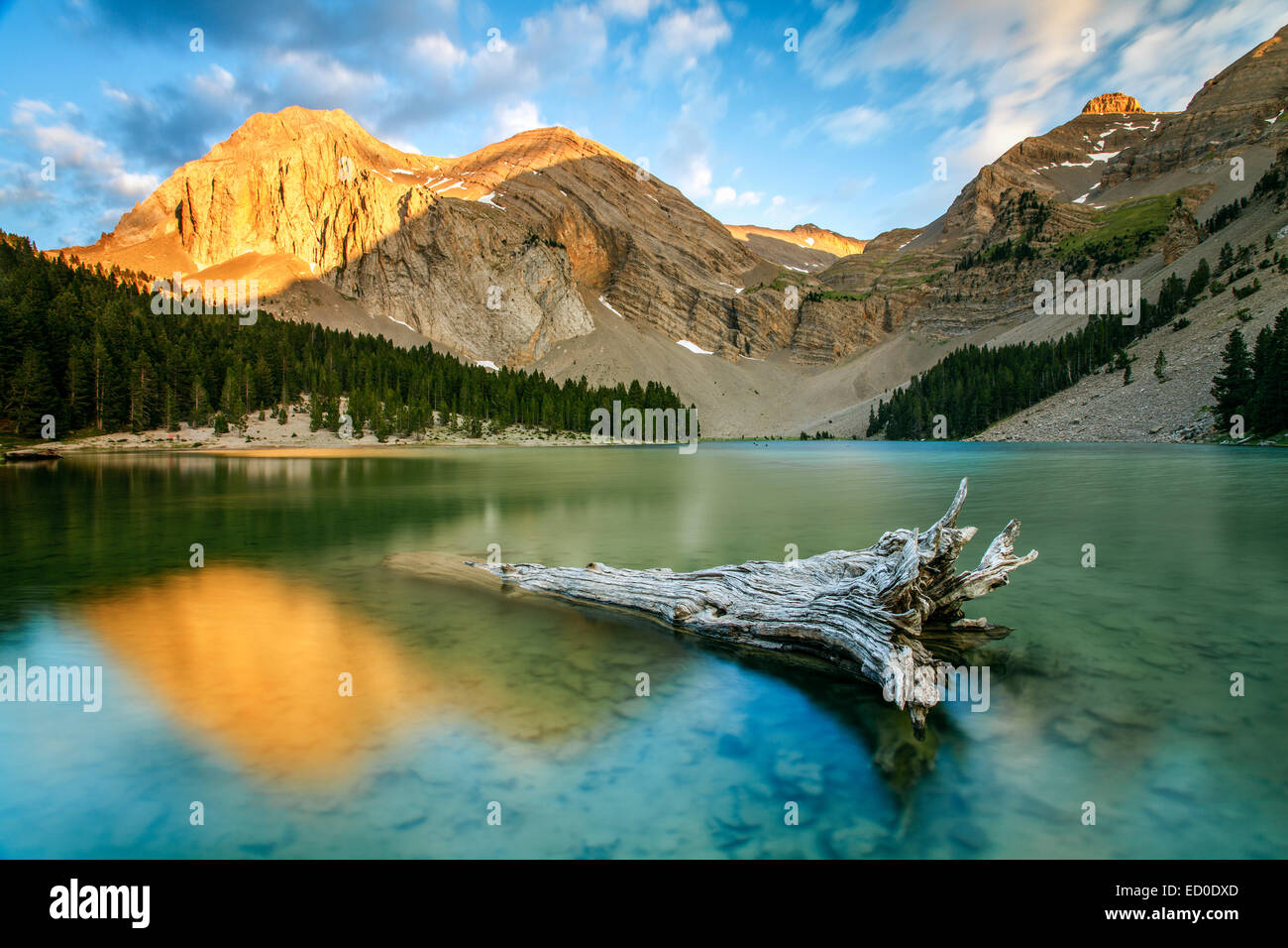 Spain, Catalonia, Huesca, Pyrenees, Lake at foot of mountain range ...