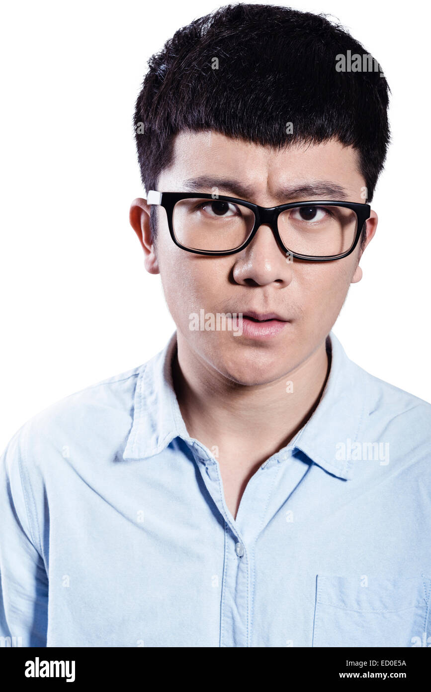 Portrait of suspicious young man Stock Photo - Alamy