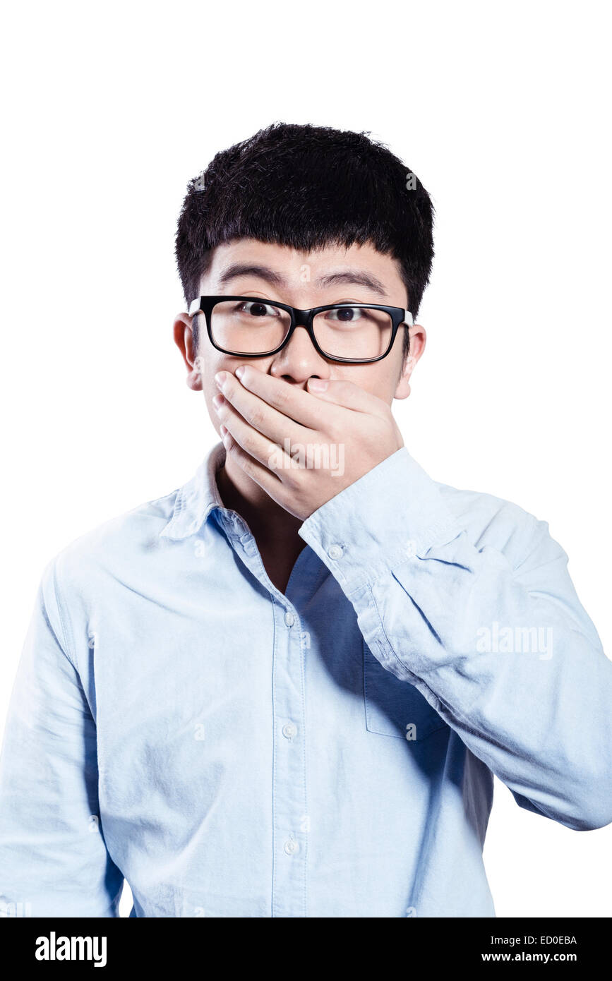 Young man covering mouth Stock Photo - Alamy